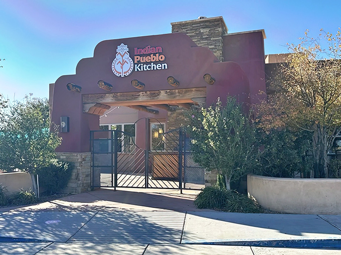 The terracotta-hued entrance to Indian Pueblo Kitchen stands like a welcoming sentinel, promising culinary adventures that honor centuries of Native traditions.