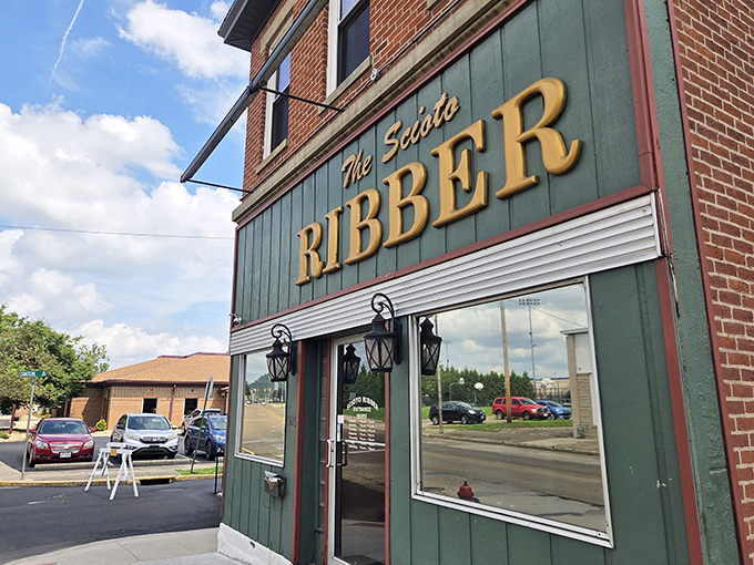 The unassuming green facade of Scioto Ribber stands like a beacon to meat lovers. Those gold letters promise more than just a meal—they're an invitation to carnivore paradise.