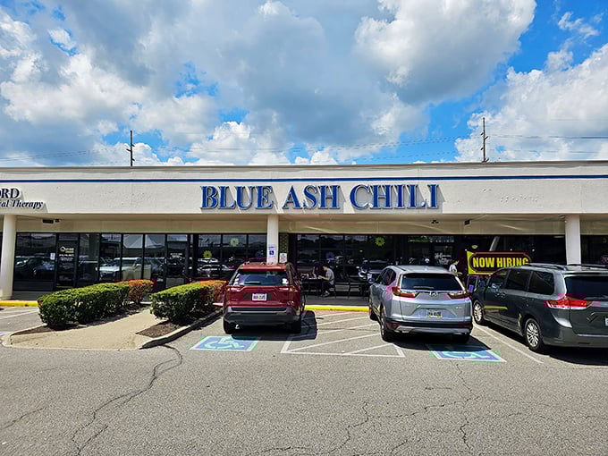 The bold blue lettering against white stucco promises no frills, just the honest-to-goodness flavor bombs waiting inside.