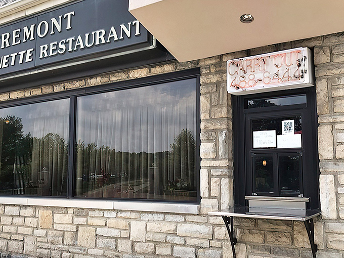 That neon "CARRY OUT" sign isn't just illuminating the entrance&mdash;it's beckoning you into a world where comfort food reigns supreme.