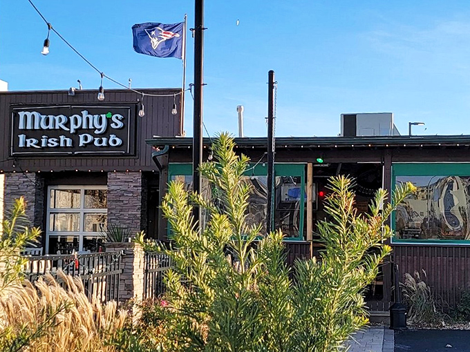 Murphy's Irish Pub stands proudly against the Virginia Beach skyline, its stone facade and Celtic lettering promising authentic Irish comfort just steps from the Atlantic.