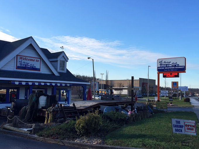 The Shrimp Dock's charming blue-trimmed exterior stands as a beacon of hope for seafood lovers stranded in landlocked Tennessee. Ocean dreams come true here!
