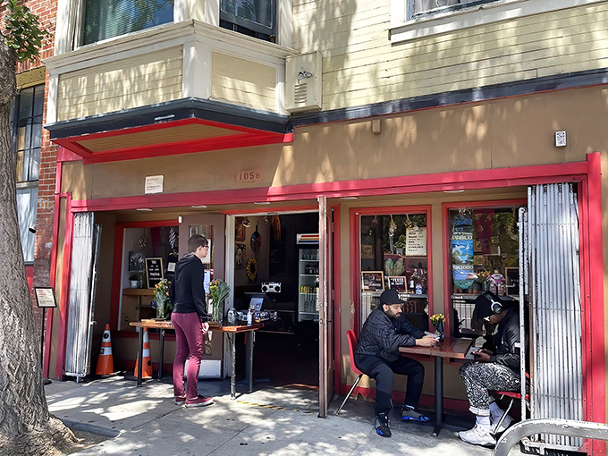 The bright red trim of Deli Board beckons like a culinary lighthouse on Folsom Street, promising sandwich salvation to the hungry masses of SoMa.