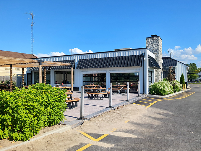 From another angle, the outdoor seating area beckons with picnic tables perfect for those Lake Erie summer days when dining al fresco feels mandatory.
