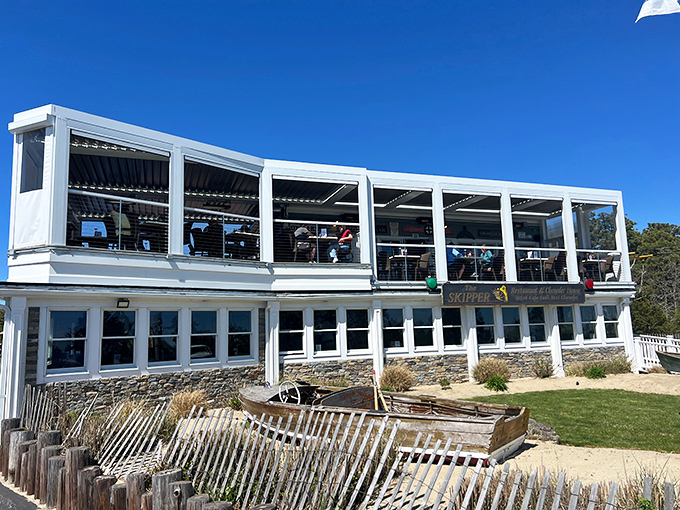 Cape Cod architecture at its finest&mdash;weathered beach fencing below, panoramic ocean views above, and seafood magic happening inside.