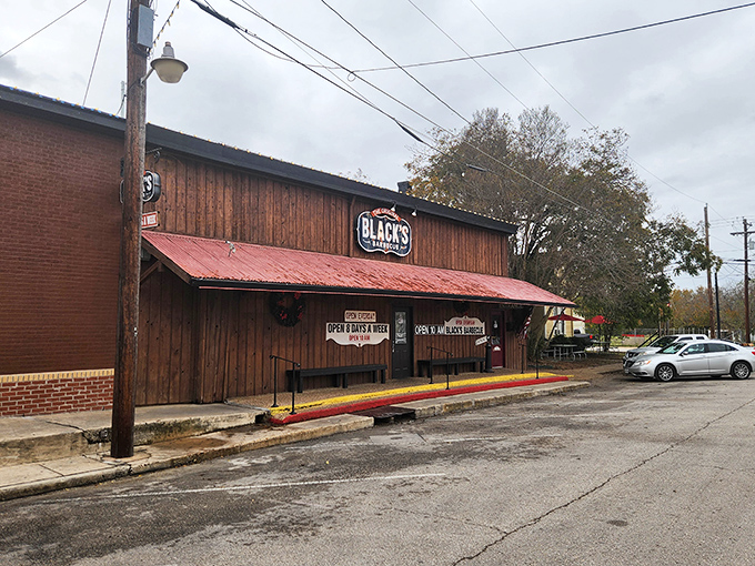 That weathered wood exterior isn't trying to impress anyone, which is exactly why it impresses everyone who knows good barbecue.