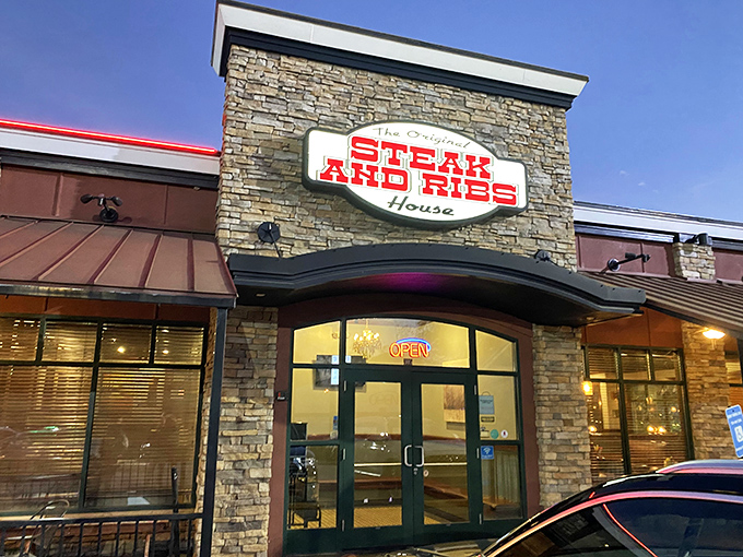 The stone facade with that bold red sign promises exactly what you'll find inside: no-nonsense deliciousness that doesn't need fancy frills to impress.