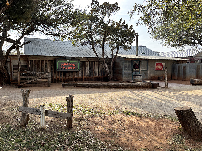 Rustic charm doesn't get more authentic than this weathered wooden exterior. The neon sign promises what every Texan dreams about: serious steak business ahead.