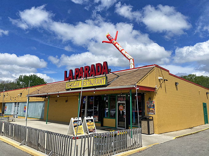 That iconic yellow exterior and waving tube man aren't just inviting you in&mdash;they're practically doing the Mexican hat dance of welcome.