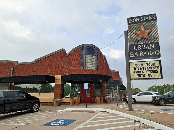 The iconic curved brick facade and star-adorned sign of Iron Star Urban BBQ stands as Oklahoma City's beacon for serious meat enthusiasts.