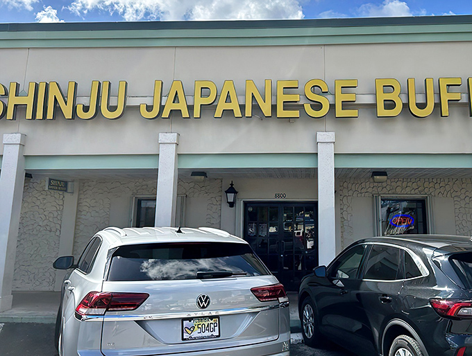 The bright yellow sign beckons like a lighthouse for the hungry, promising Japanese treasures within this unassuming Miami strip mall location.