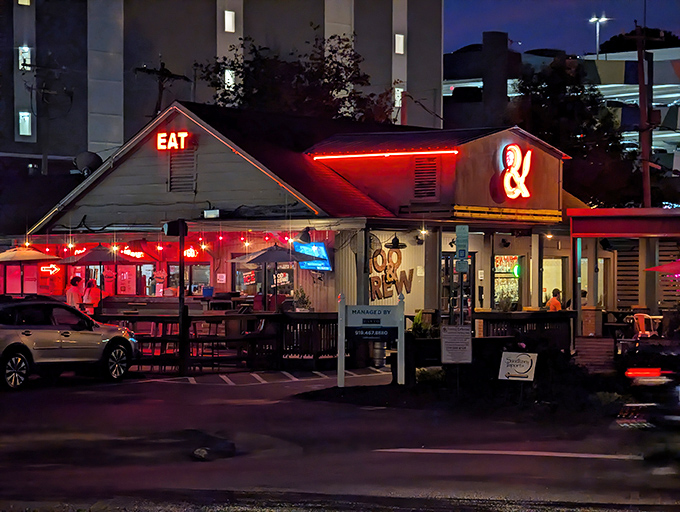 The neon-lit exterior of Moo & Brew glows like a burger beacon in the Charlotte night, promising comfort food salvation to hungry souls.