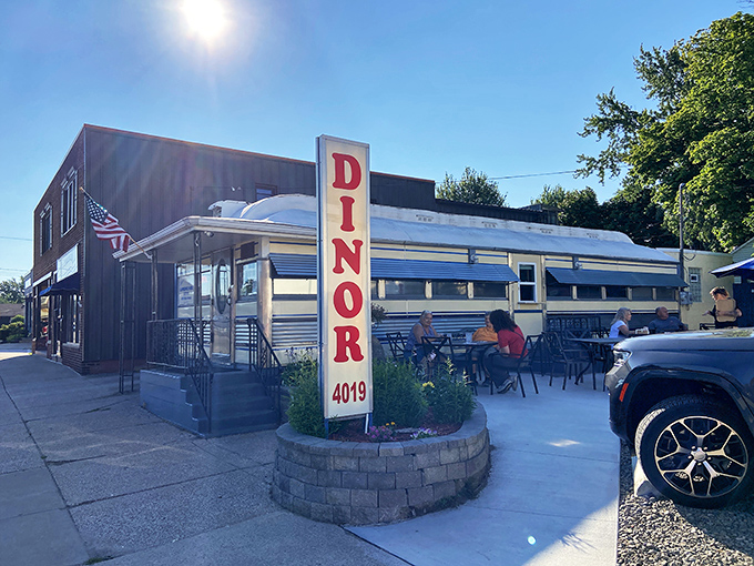 That iconic vertical "DINOR" sign isn't a typo&mdash;it's pure Erie, Pennsylvania tradition standing proud against the blue sky.