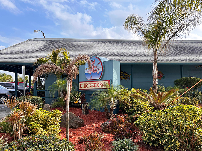 Tropical landscaping welcomes hungry visitors, with palm trees standing guard like maitre d's in Hawaiian shirts.