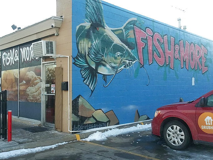 A vibrant mural adorns the side wall, proving this humble spot has both artistic flair and seafood swagger in equal measure.