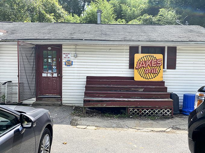 That bright yellow sign against the white clapboard is like a beacon to barbecue pilgrims&mdash;simple, straightforward, and promising smoky salvation inside.
