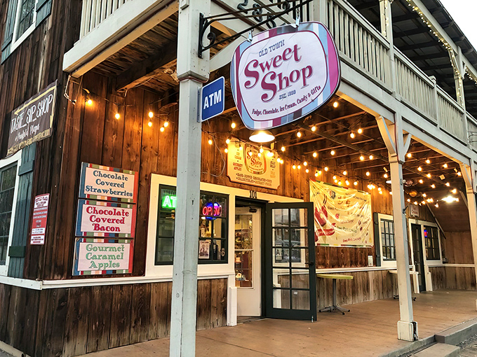 The wooden facade of Old Town Sweet Shop glows with promise, like a beacon calling to your inner eight-year-old. String lights and candy signs seal the deal.