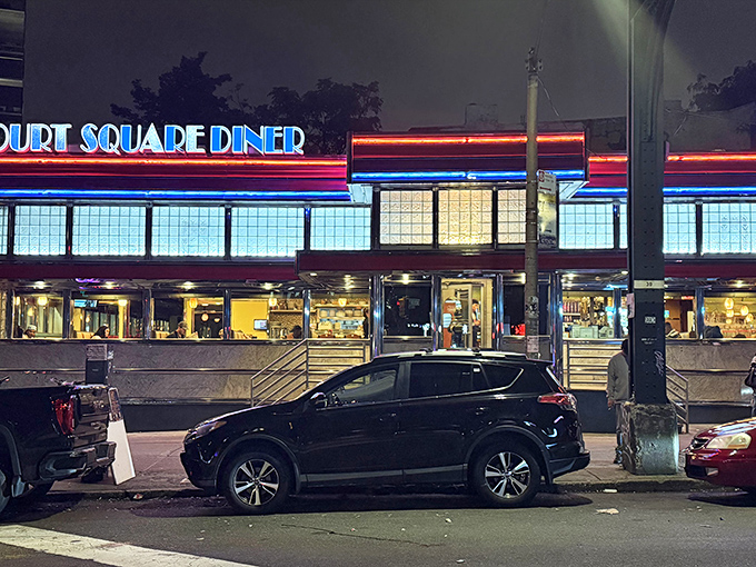 The neon glow of Court Square Diner cuts through the night like a beacon for hungry souls. Classic Americana at its finest.