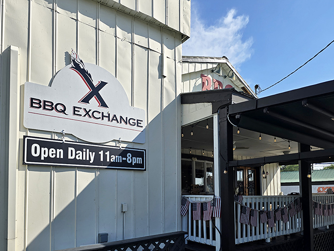 A classic white clapboard exterior with bold red "BBQ" lettering &ndash; the universal signal that life-changing pulled pork awaits inside.