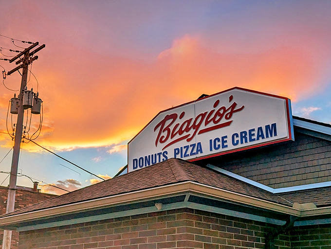 Sunset magic at Biagio's, where that iconic sign promises three essential food groups: donuts, pizza, and ice cream. Some might call that the perfect trifecta of comfort.