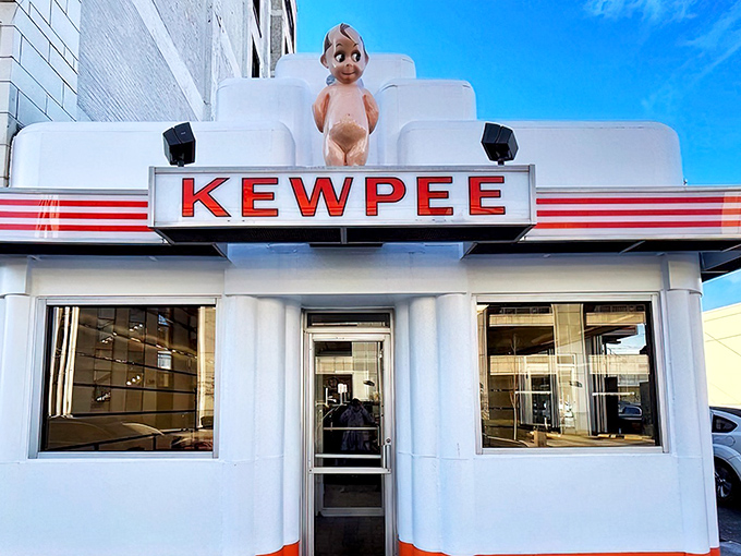 The iconic Kewpee exterior stands like a time capsule of Americana, complete with its Art Deco styling and that watchful doll keeping an eye on hungry visitors.