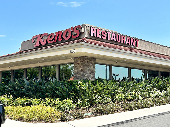 The iconic red signage of Keno's Restaurant stands out against the California blue sky, promising comfort food that's worth the detour from Disneyland.