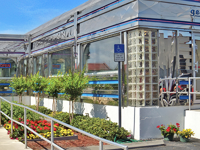 Meticulously landscaped with vibrant flowers and greenery, Georgie's classic diner architecture stands as a chrome-clad beacon for breakfast lovers in St. Augustine.