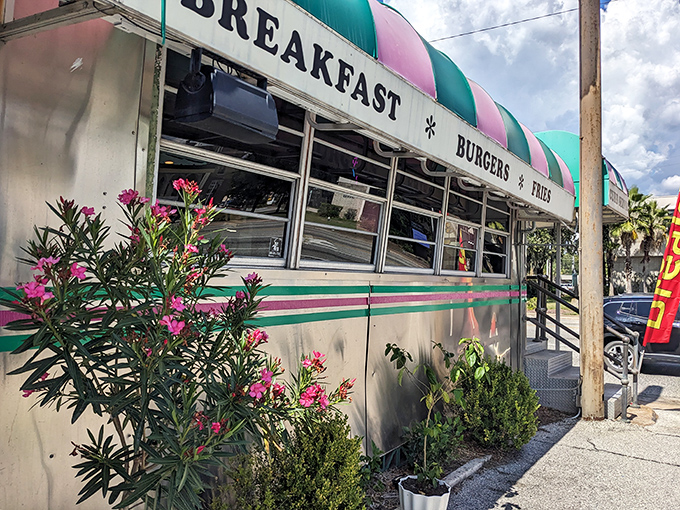 That turquoise and pink striped awning isn't just decoration &ndash; it's a beacon calling you home to burger paradise.