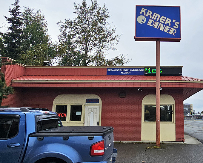 The iconic blue sign beckons hungry travelers like a lighthouse for the breakfast-obsessed. Comfort food paradise awaits inside this unassuming brick building.
