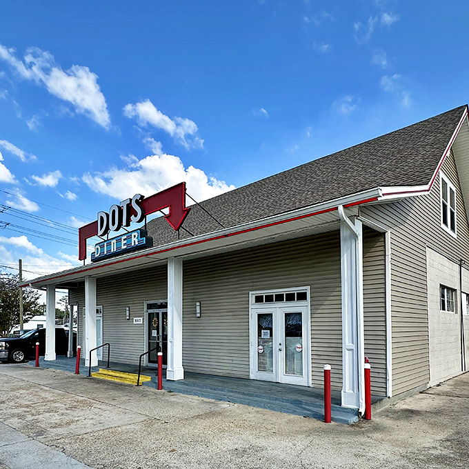 The iconic red sign beckons like a lighthouse for hungry souls. Dots Diner's unassuming exterior houses breakfast treasures that locals have cherished for generations.