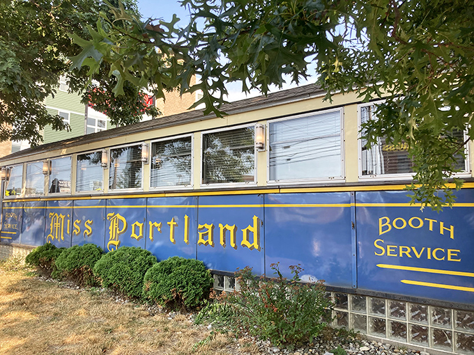 Sunlight dances across the royal blue exterior, highlighting the golden "Miss Portland" script&mdash;a beacon of breakfast hope for hungry Mainers since the 1940s.