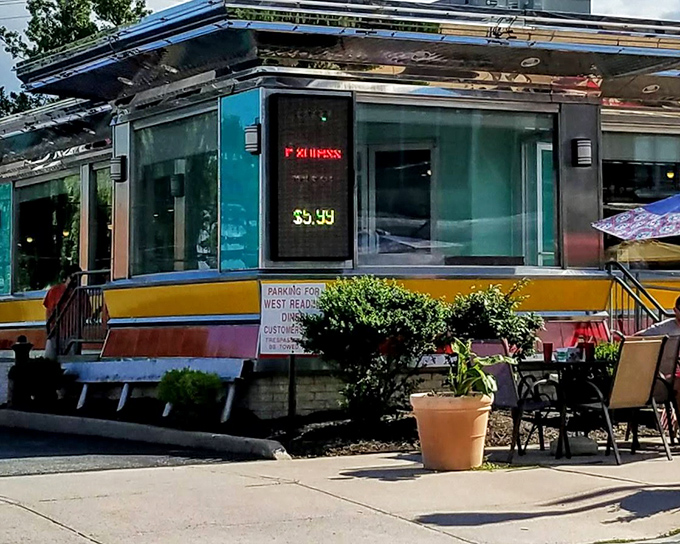The gleaming chrome exterior of The American Diner shines like a beacon of breakfast hope on West Reading's streetscape, promising nostalgic comfort with modern flair.