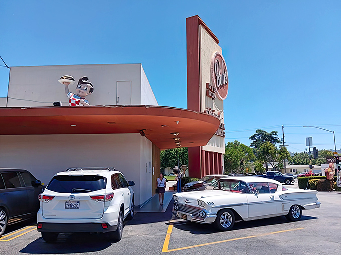 Classic cars and modern rides share the parking lot at Bob's Big Boy, where Friday nights transform into an impromptu automotive museum.