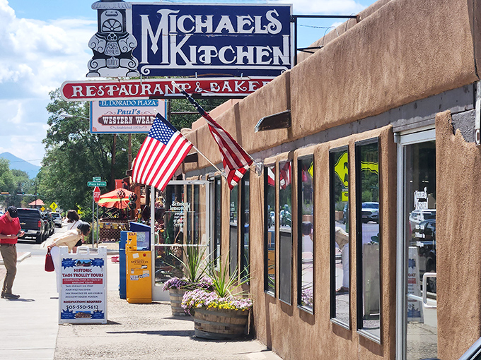 The iconic sign beckons like a desert mirage, promising culinary salvation to hungry Taos travelers. Those American flags aren't just decoration&mdash;they're celebrating your taste buds' independence day.