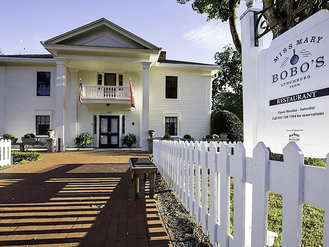 The white colonial facade of Miss Mary Bobo&rsquo;s stands like a Southern sentinel, its welcoming porch and classic charm inviting guests to step inside and savor tradition.