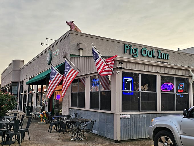 American flags flutter proudly outside this unassuming temple of smoke, where meat dreams become reality.