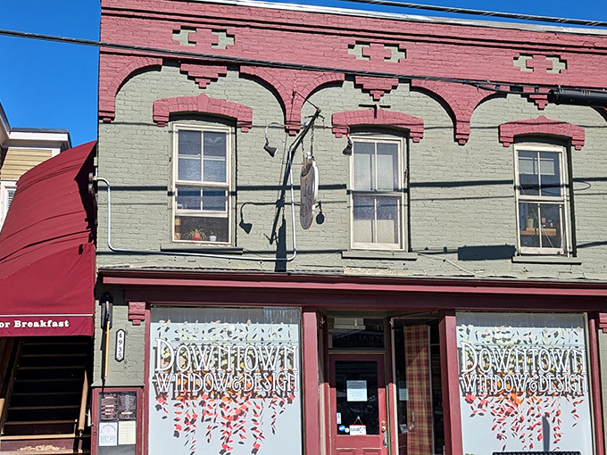 The historic brick fa&ccedil;ade with its distinctive red awning promises breakfast salvation for hungry travelers. Vermont mornings start here.