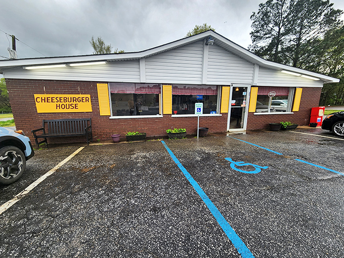 The unassuming brick exterior with bright yellow shutters stands as a testament that culinary greatness often hides in plain sight.