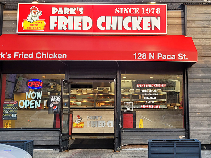 The bright red storefront of Park's Fried Chicken on N Paca St stands like a beacon to hungry Baltimoreans. Fried chicken salvation awaits inside.