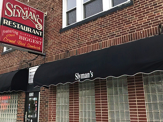 The iconic red Slyman's sign promises "Cleveland's BIGGEST Corned Beef Sandwich" &ndash; a claim that isn't hyperbole but delicious truth.