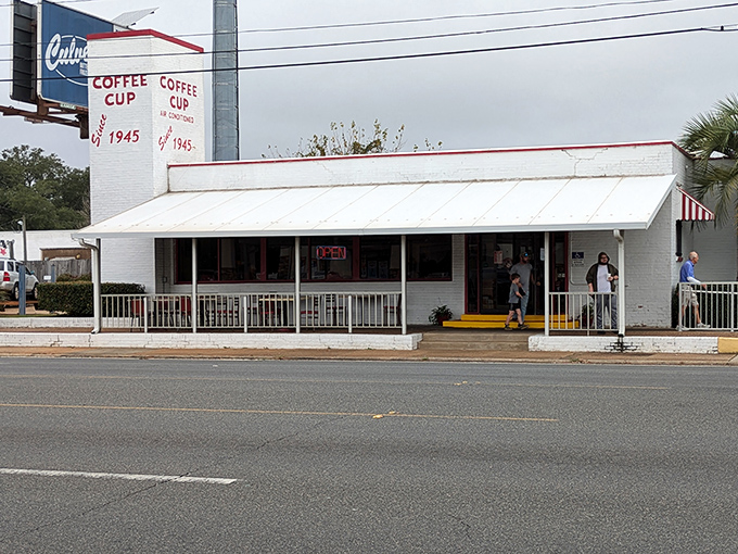 The unassuming white exterior of Coffee Cup Restaurant has been welcoming hungry Pensacolians since 1945, proving that breakfast greatness doesn't need fancy architecture.