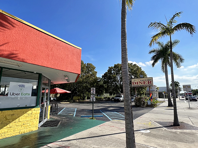 The iconic coral-red facade of Jimmy's stands out against Miami's blue sky like a beacon calling all breakfast lovers home.