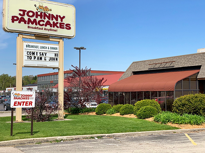 The iconic Johnny Pamcakes sign promises "Breakfast Anytime!" &ndash; three words that should be enshrined in the culinary hall of fame. The red awning beckons like an old friend waving you in. 