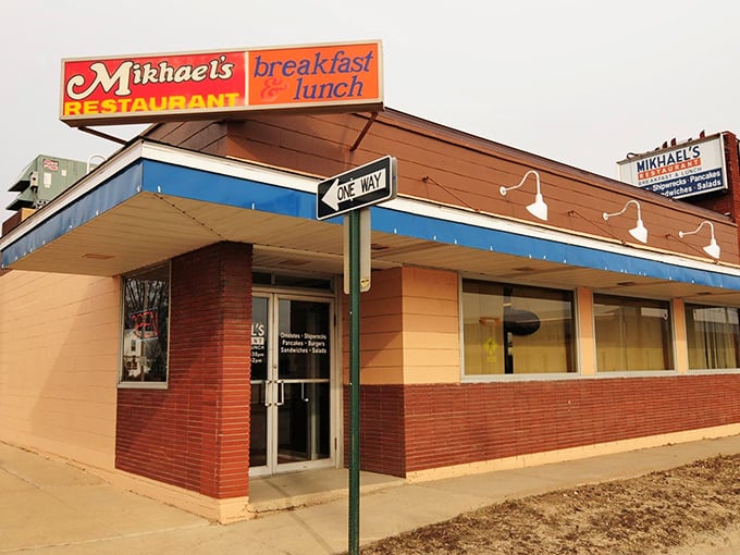 The iconic red and blue sign beckons hungry travelers like a lighthouse for breakfast lovers. One way? Yes, the way to satisfaction.