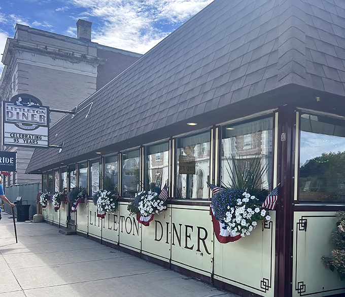 Patriotic flower boxes and welcoming windows frame this culinary landmark that's been serving comfort to generations of Granite Staters.