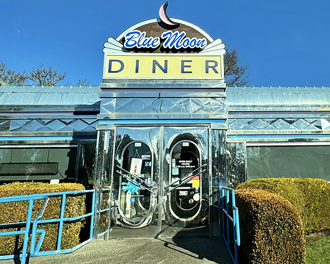 The gleaming chrome exterior of Blue Moon Diner shines like a beacon of breakfast hope. That iconic sign promises delicious nostalgia served all day.