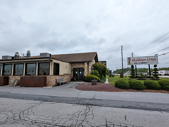 The stone-faced exterior of Middlesex Diner stands like a culinary lighthouse, beckoning hungry travelers with its promise of homestyle comfort.