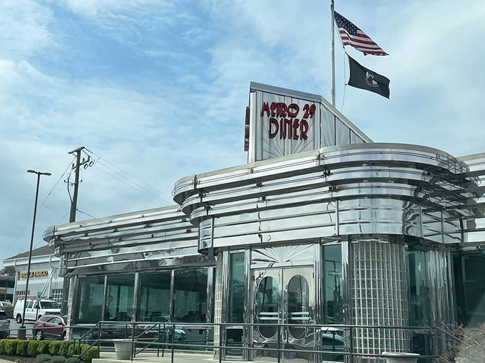 The gleaming stainless steel exterior of Metro 29 Diner stands like a time capsule of Americana, beckoning hungry travelers with its retro charm.