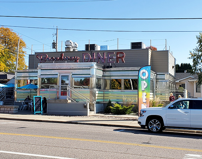 The classic stainless steel exterior of Broadway Diner gleams in the Wisconsin sunshine, a chrome-clad time capsule promising comfort food and nostalgia in equal measure.