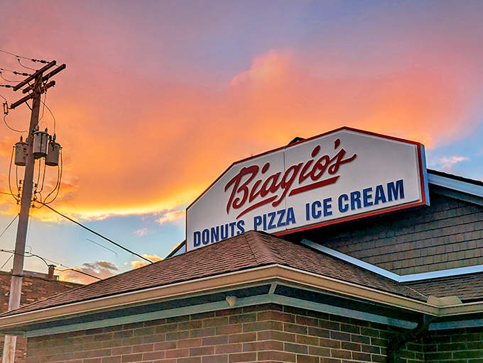 Bathed in the warm glow of sunset, Biagio&rsquo;s unassuming brick exterior hints at three simple pleasures: donuts, pizza, and ice cream&mdash;proving the best treasures often come in modest packages.